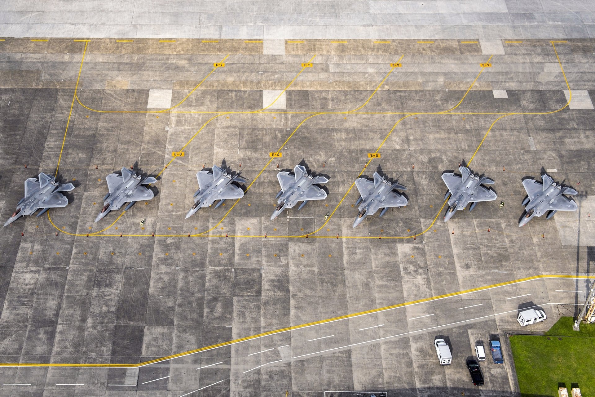 F-22 Raptor Fleet: Stunning HD Warplane Formation on Military Airbase