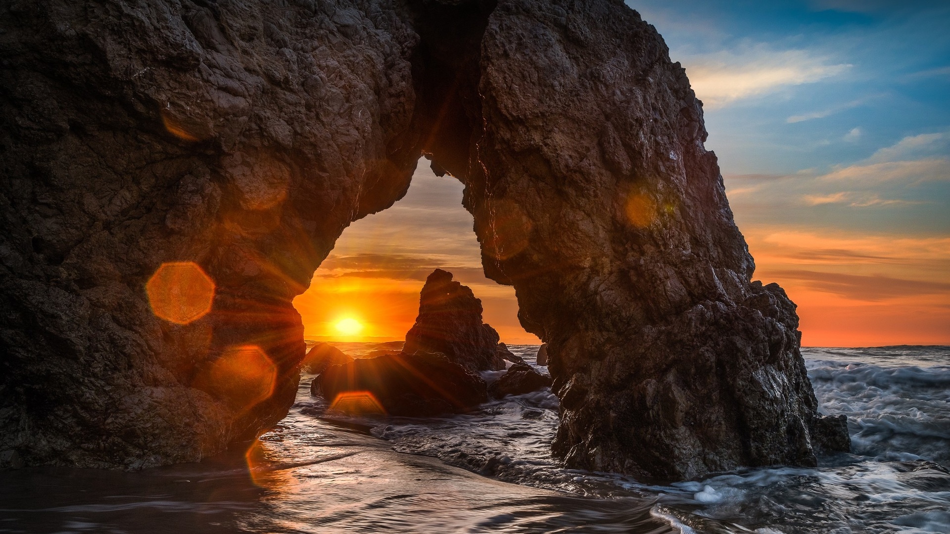 View of Sunset through Ocean Rock Arch