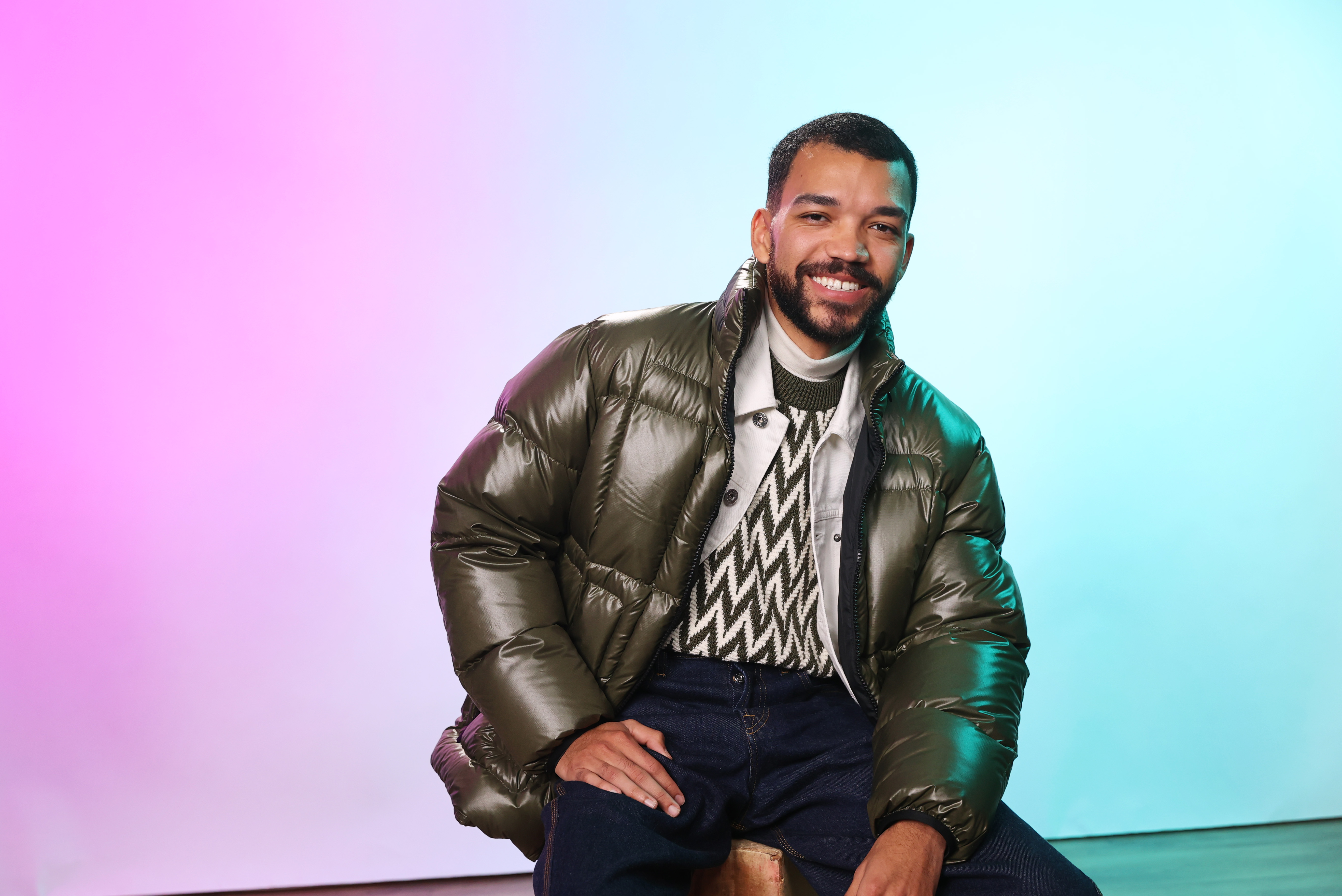 Stylish TV Show Inspired HD Wallpaper Featuring Actor in Colorful Backdrop