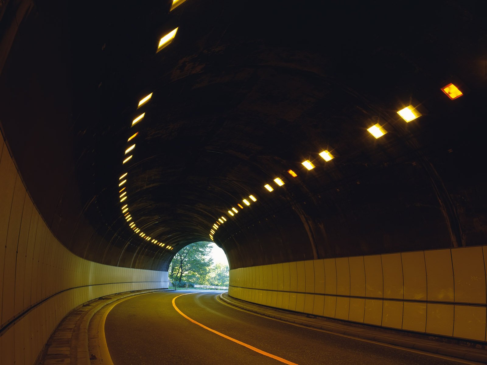 Illuminated Tunnel Road HD Wallpaper: A Man-Made Pathway