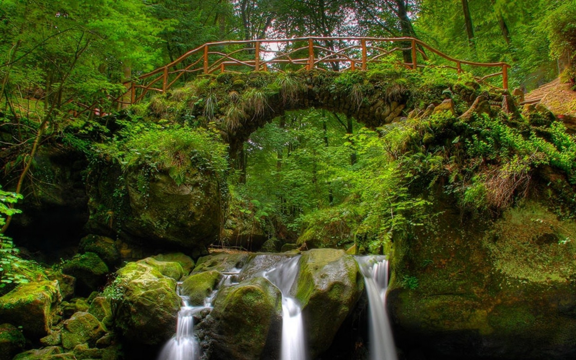 Enchanting Man-Made Bridge Over Serene Waterfall – HD Nature Wallpaper