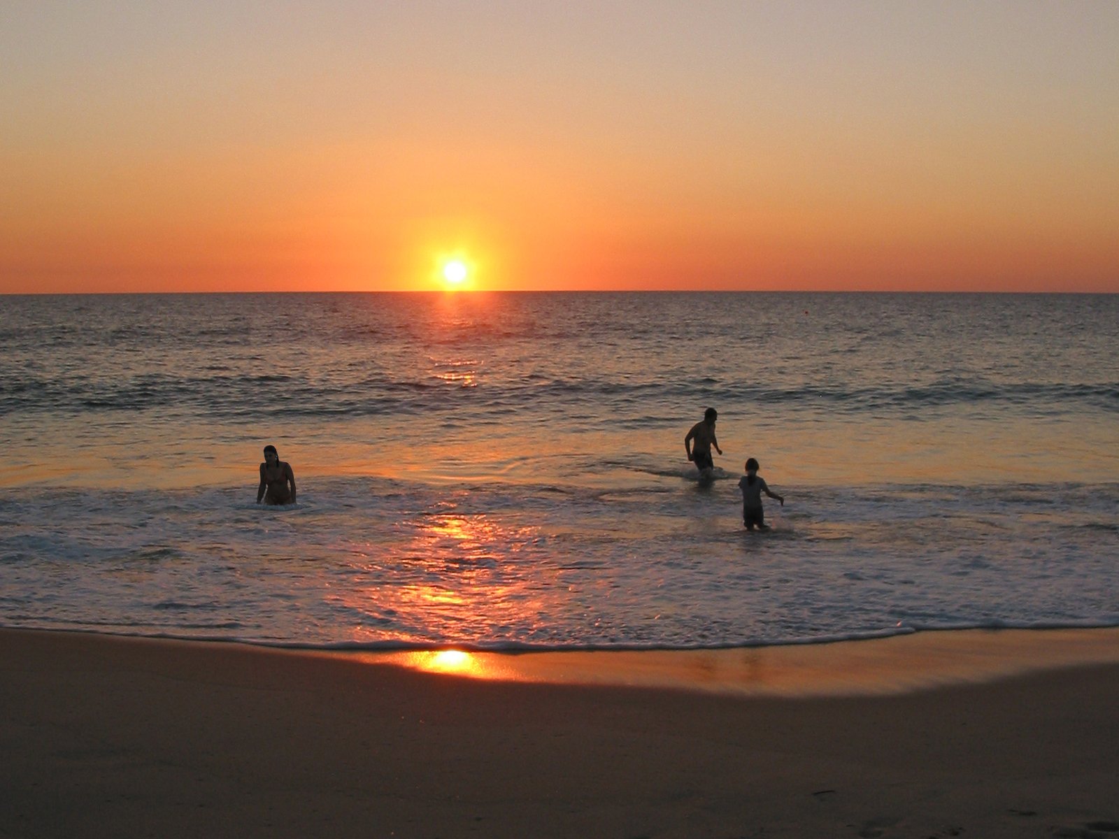Sunrise Swim: Serene Beach Moments in HD