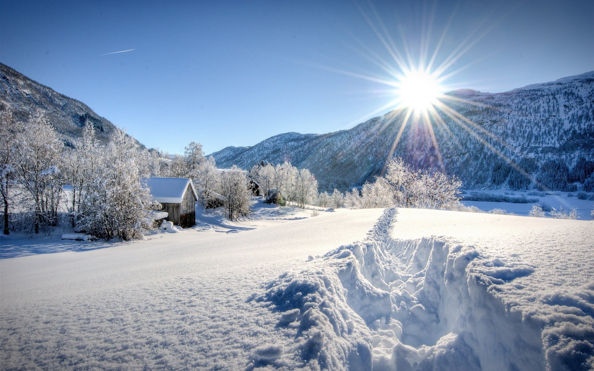 Radiant Sunbeam Over Snowy Winter Landscape – HD Photography Wallpaper