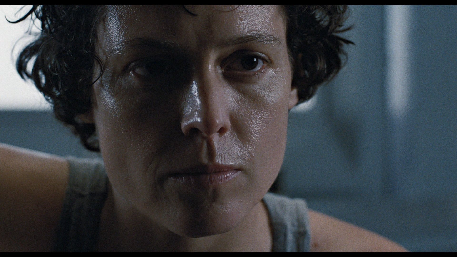 Alien Movie HD Wallpaper: Intense Close-Up of Ripley in Action