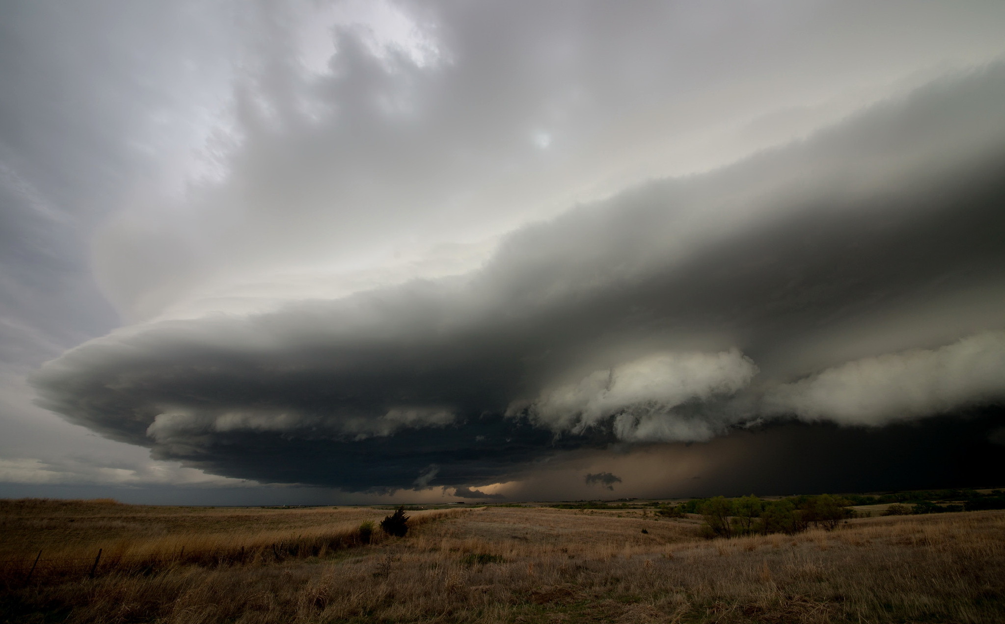 Stormy Skies Over Expansive Nature Fields – HD Landscape Wallpaper