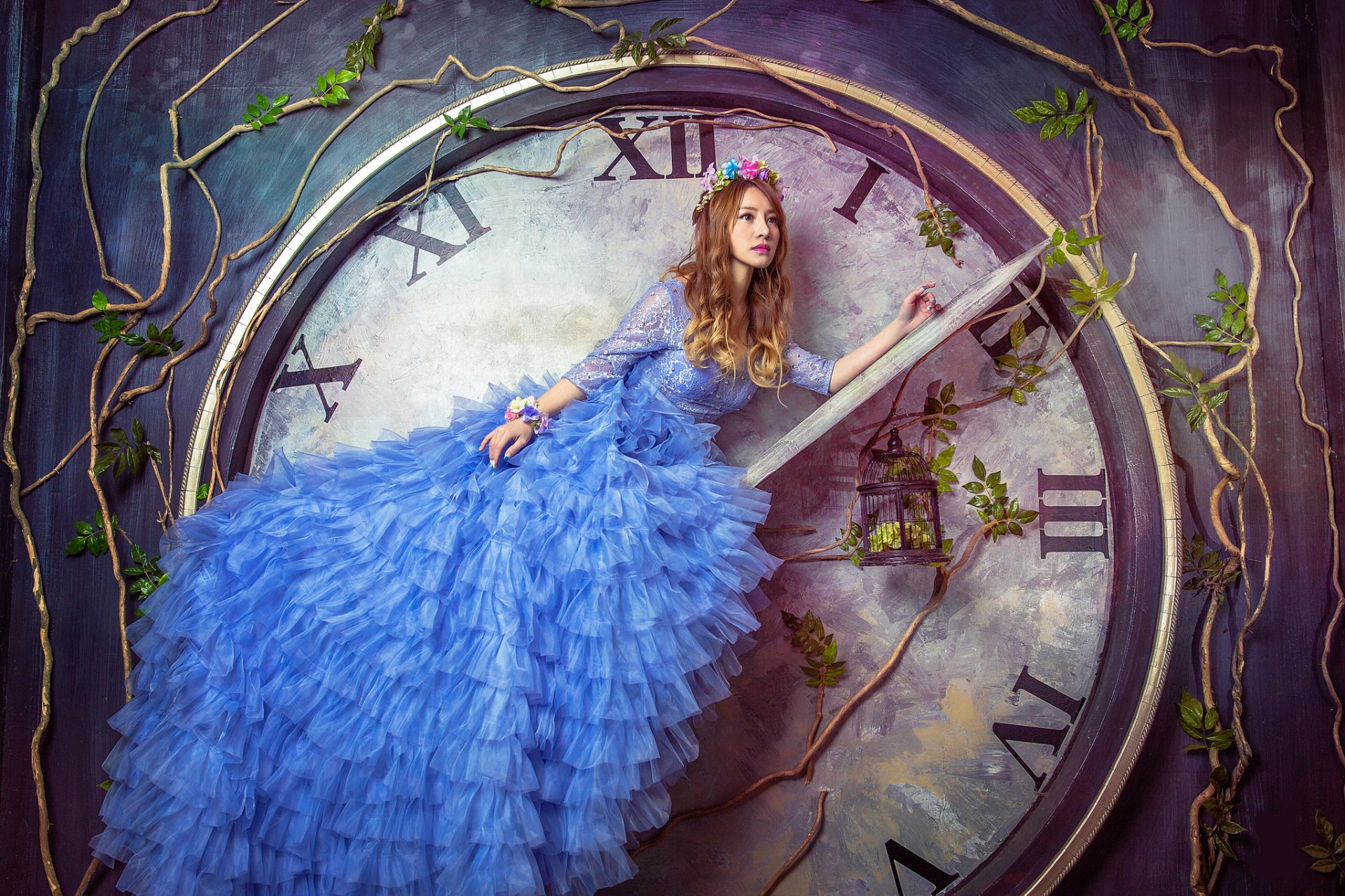 Timeless Elegance: Brunette Beauty in Blue Gown with Wreath and Clock ...