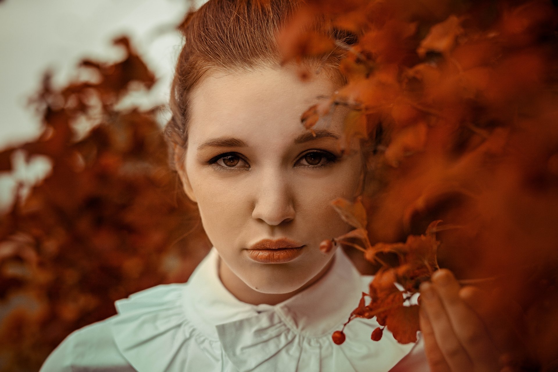 8K Ultra HD Portrait of a Brown-Eyed Woman Model Amid Autumn Leaves