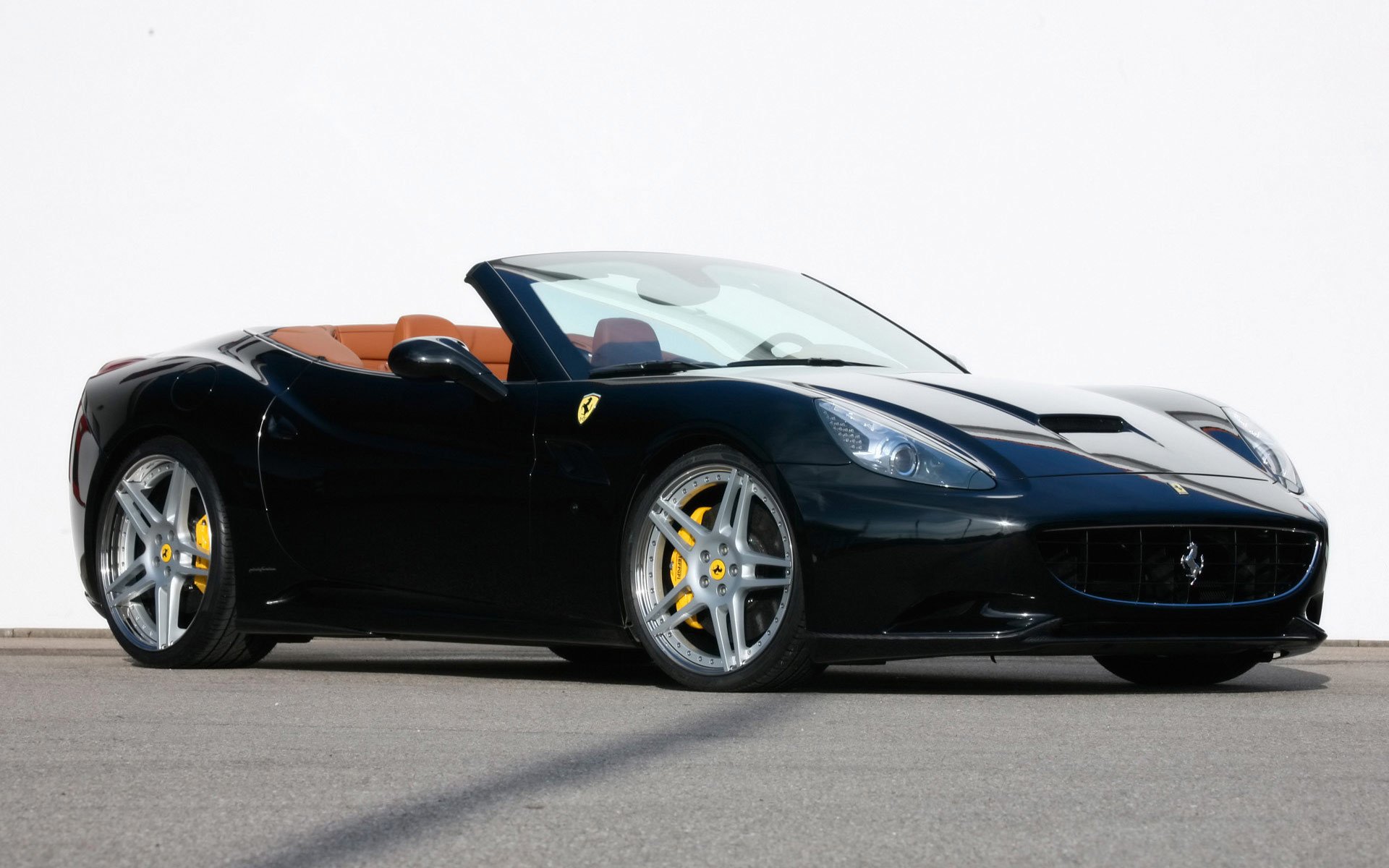 Stunning Ferrari HD Wallpaper - A Black Beauty on Wheels