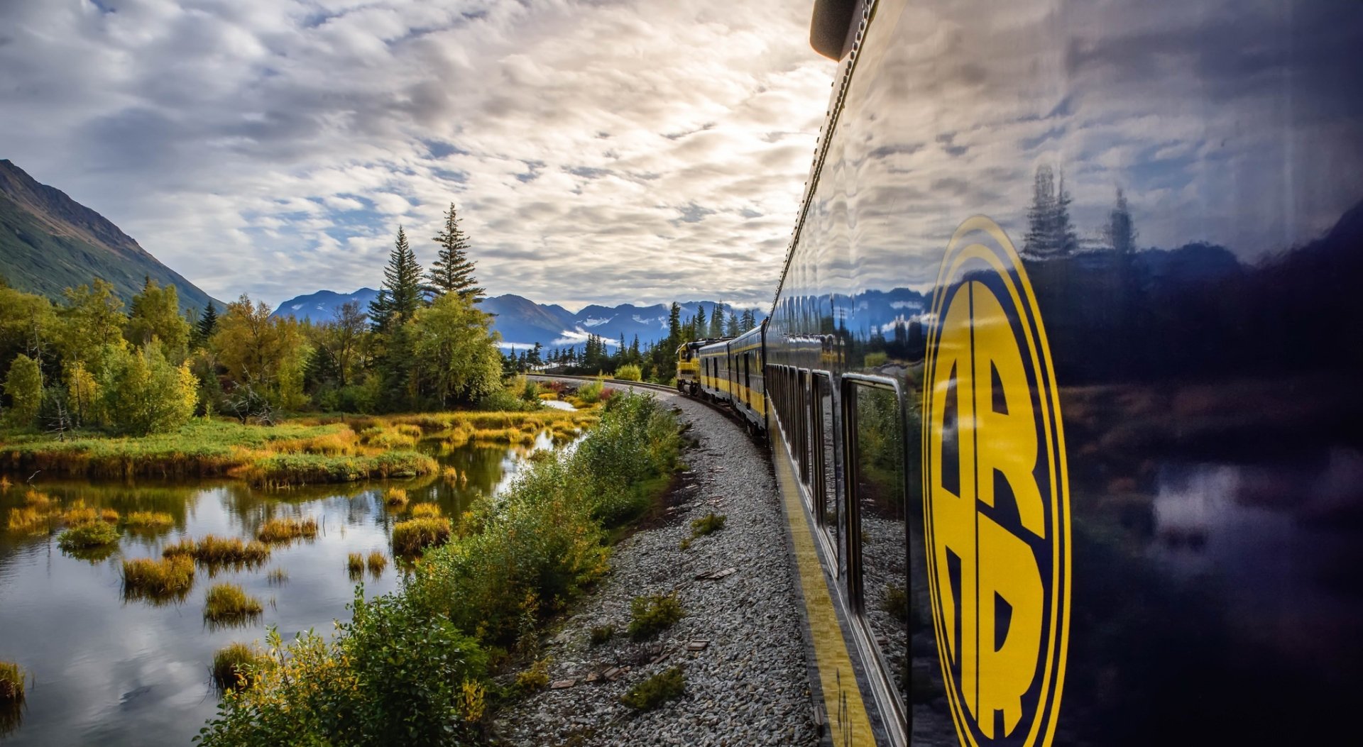 Scenic Train Journey: Reflections of Nature in HD Wallpaper