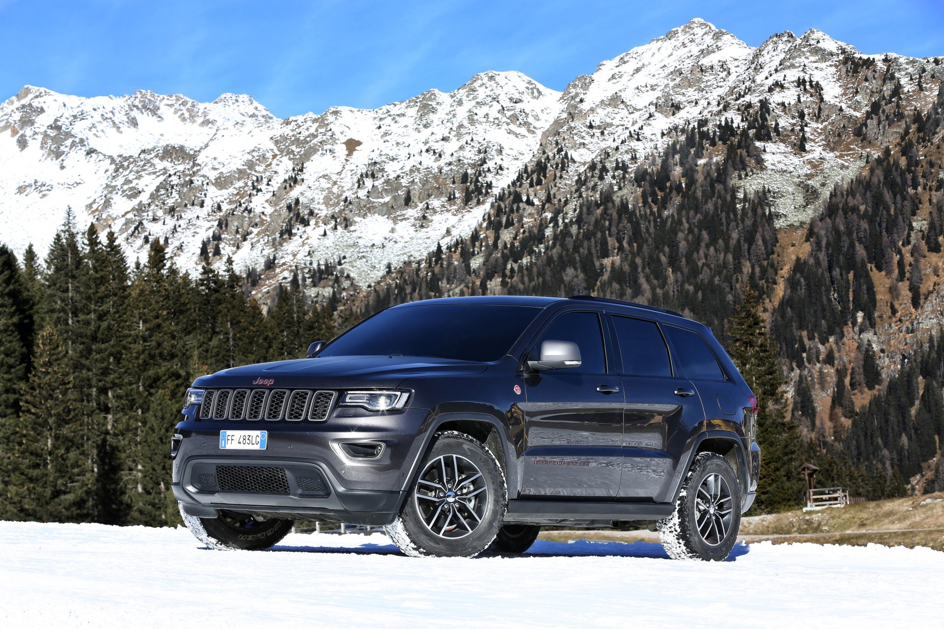 Jeep Grand Cherokee SUV in Stunning Mountain Landscape – HD Wallpaper View